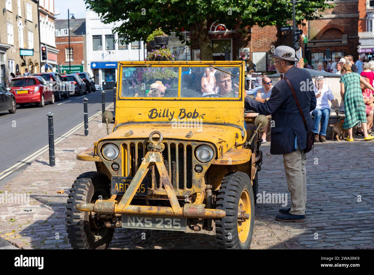 Bridport Dorset, vintage classic yellow jeep style vehicle parked in ...