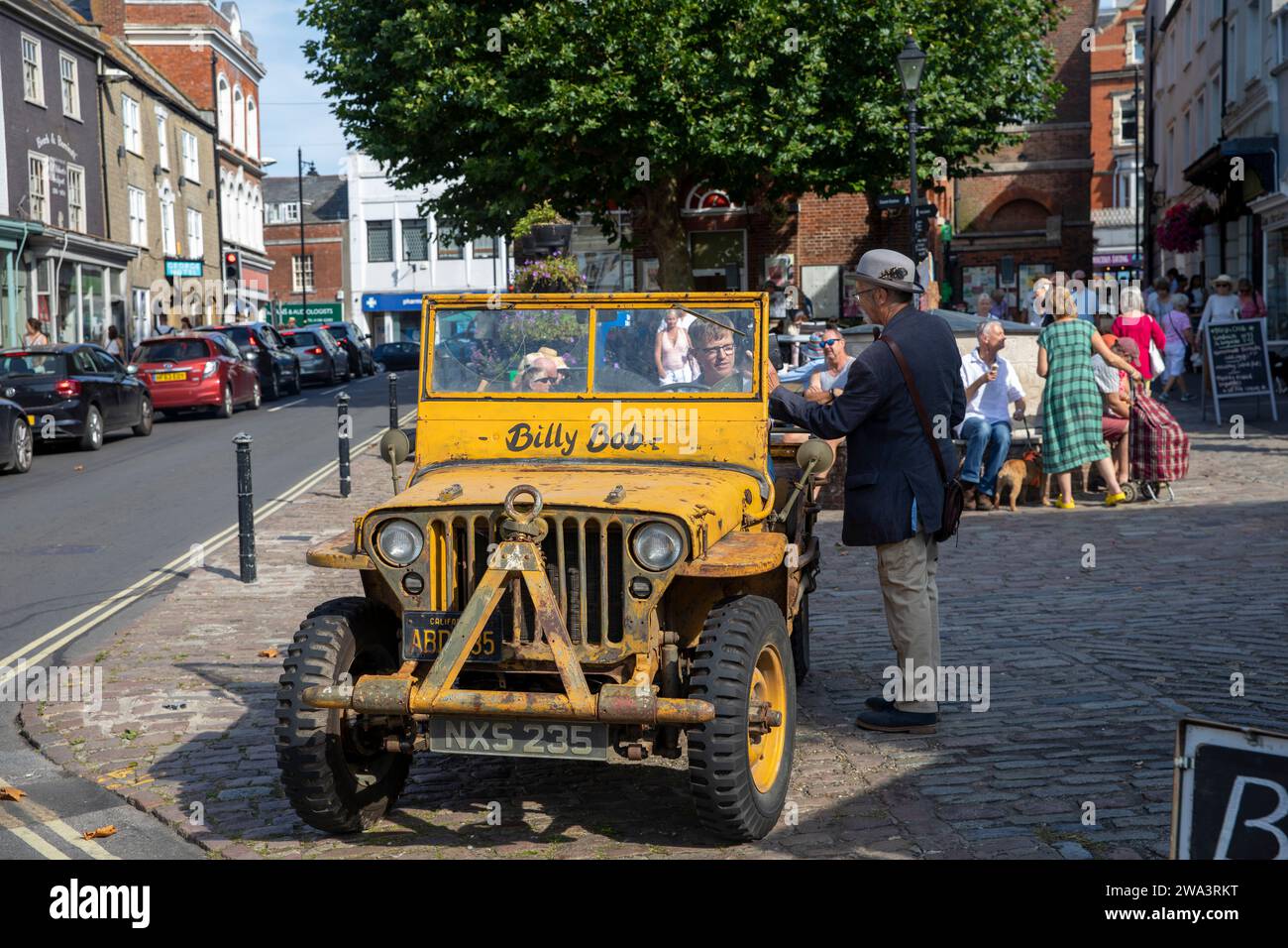 Bridport Dorset, vintage classic yellow jeep style vehicle parked in ...