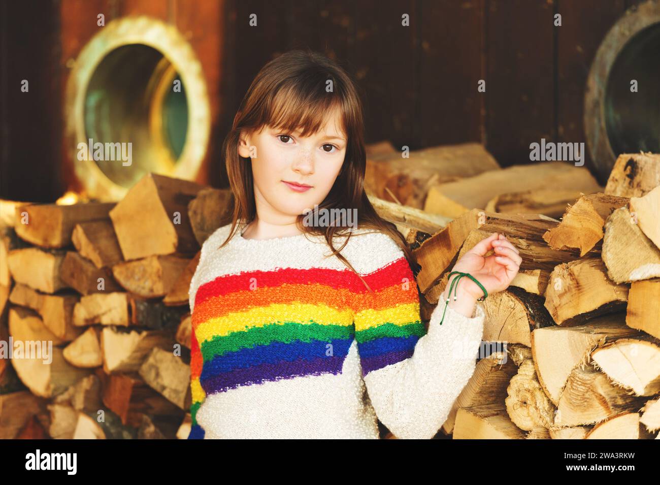 Outdoor portrait of pretty 9 year old girl posing outdoors, wearing ...