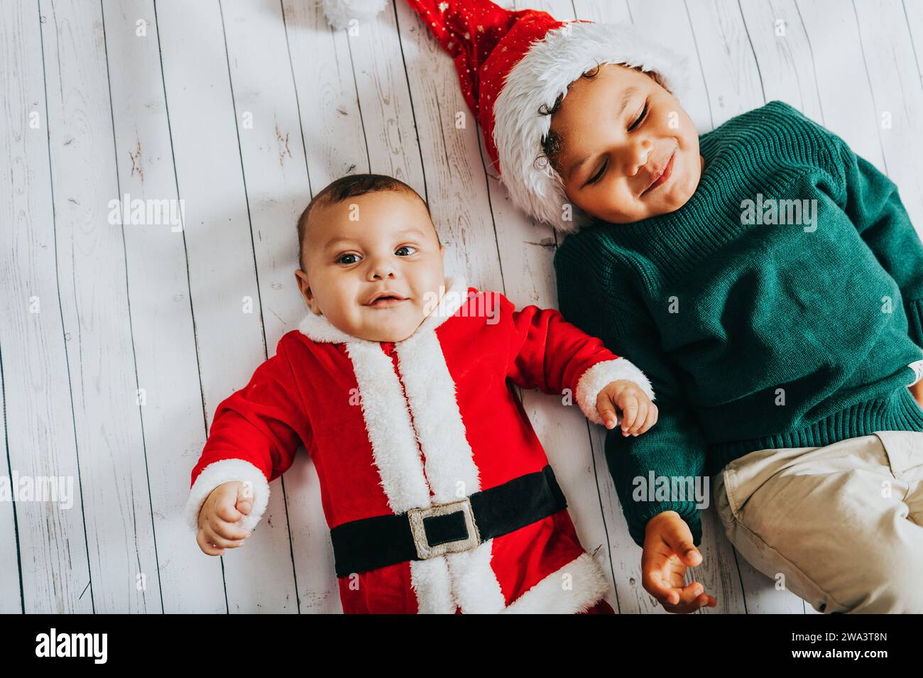 Image of two funny boys wearing christmas outfit, top view Stock Photo ...
