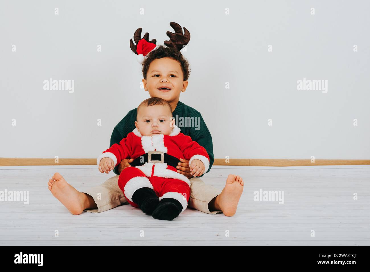 Image of two funny boys wearing christmas outfit Stock Photo - Alamy