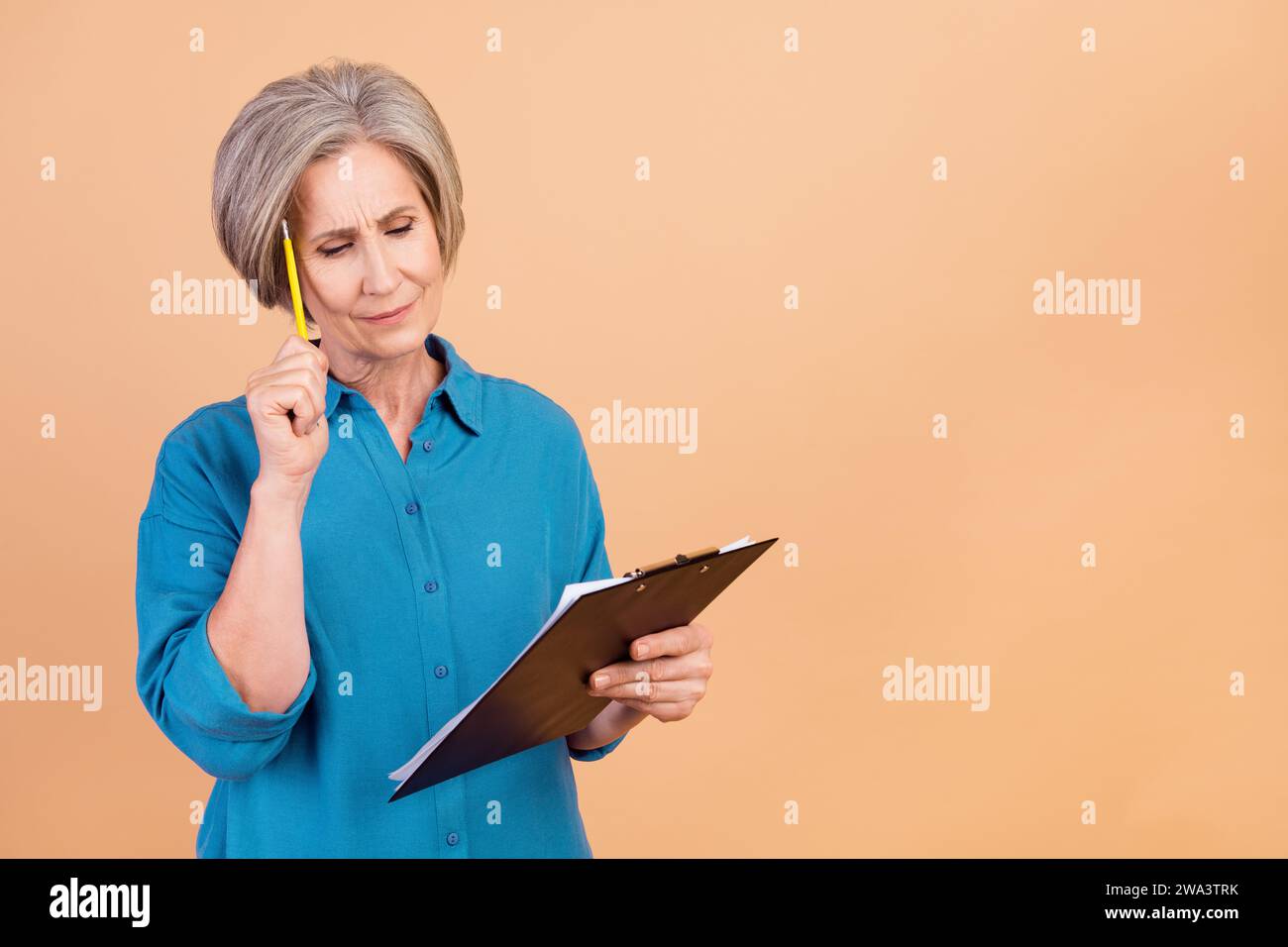 Photo of minded puzzled woman with bob hairdo dressed blue shirt look ...