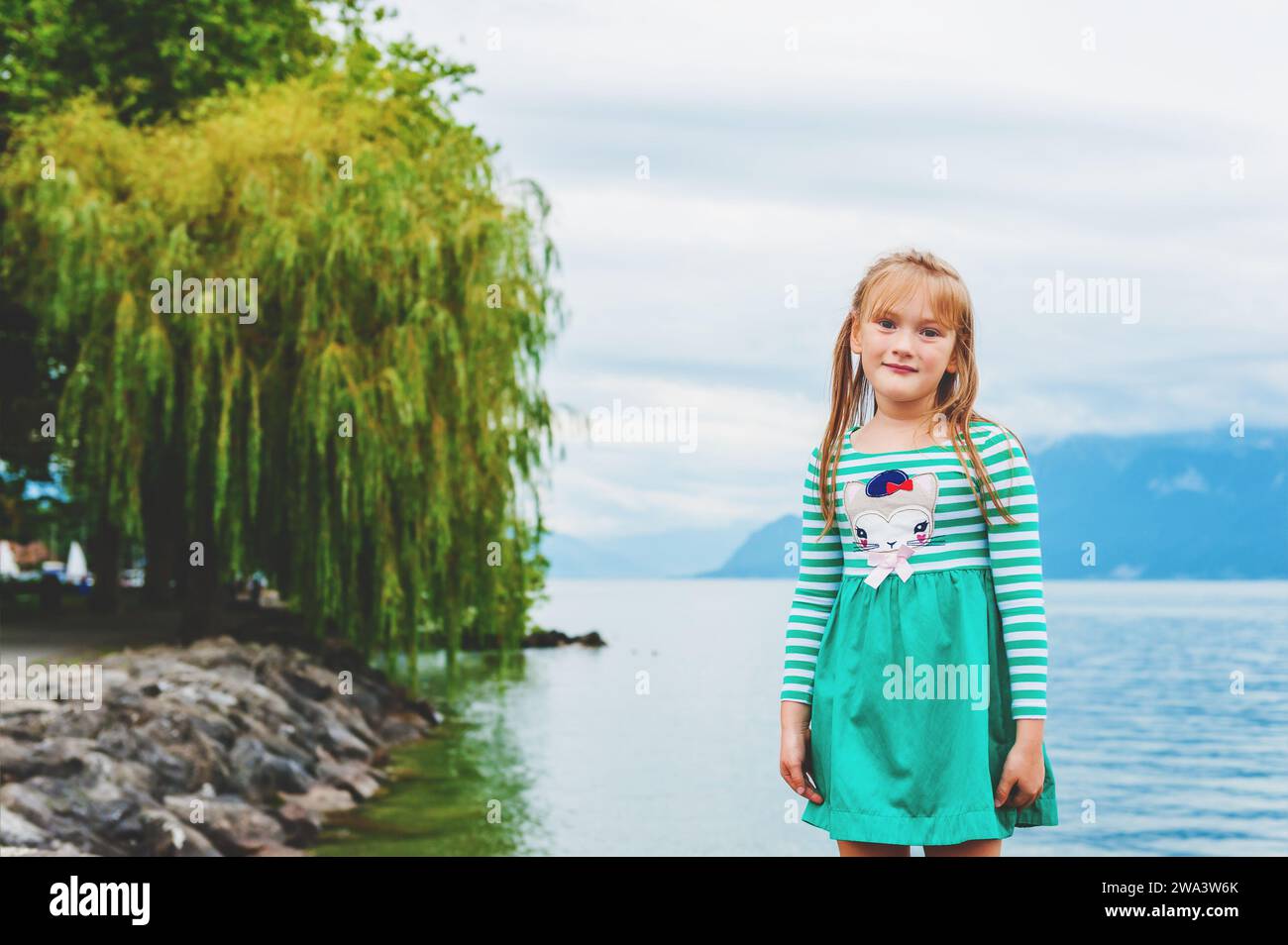 Cute little girl playing by lake Geneva, Switzerland Stock Photo - Alamy