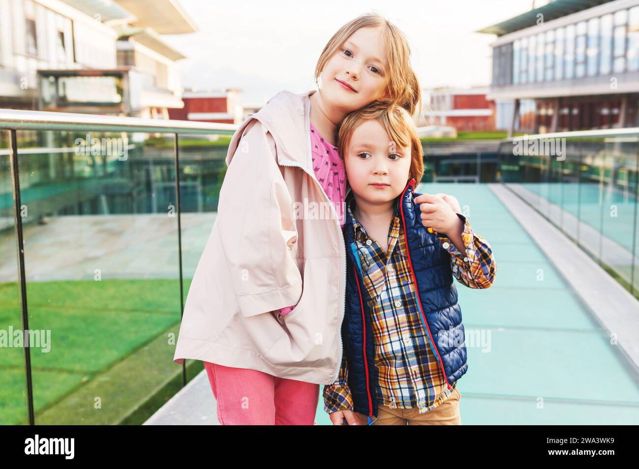Outdoor portrait of two cute kids, little brother and big sister, boy ...