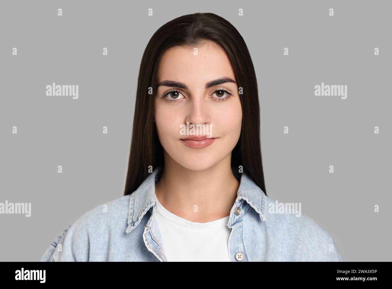 Portrait of beautiful woman on grey background Stock Photo - Alamy