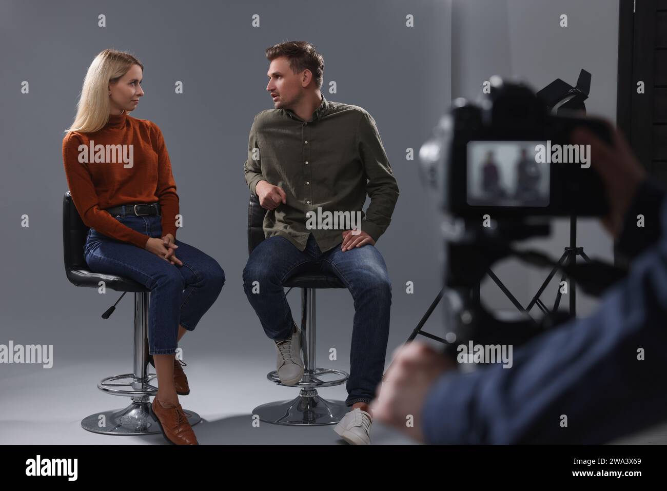 Casting call. Man and woman performing while camera operator filming ...