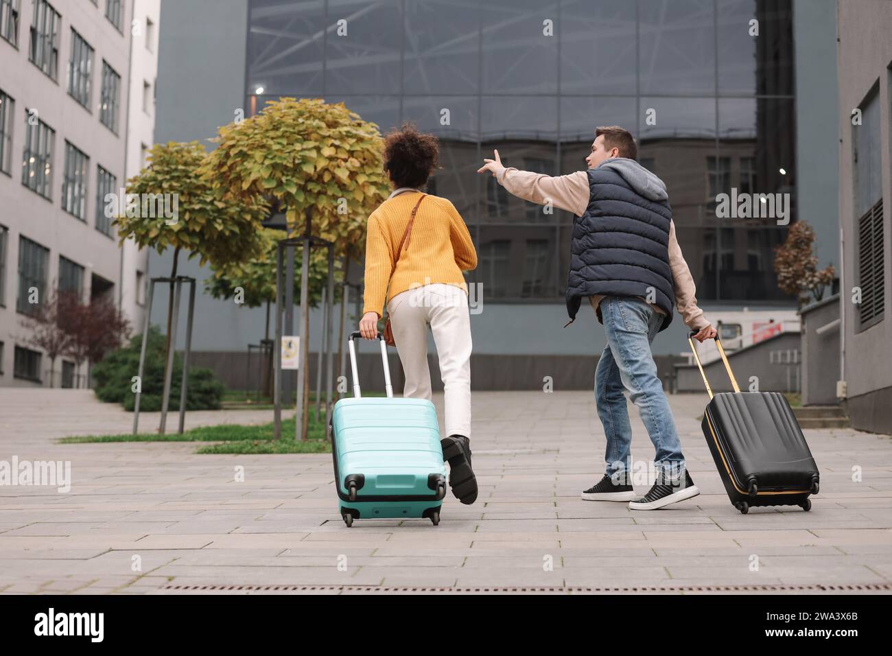 Man running late with suitcases hi-res stock photography and images - Alamy