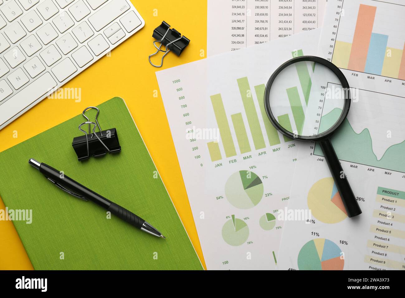 Accounting documents, magnifying glass, computer keyboard and ...