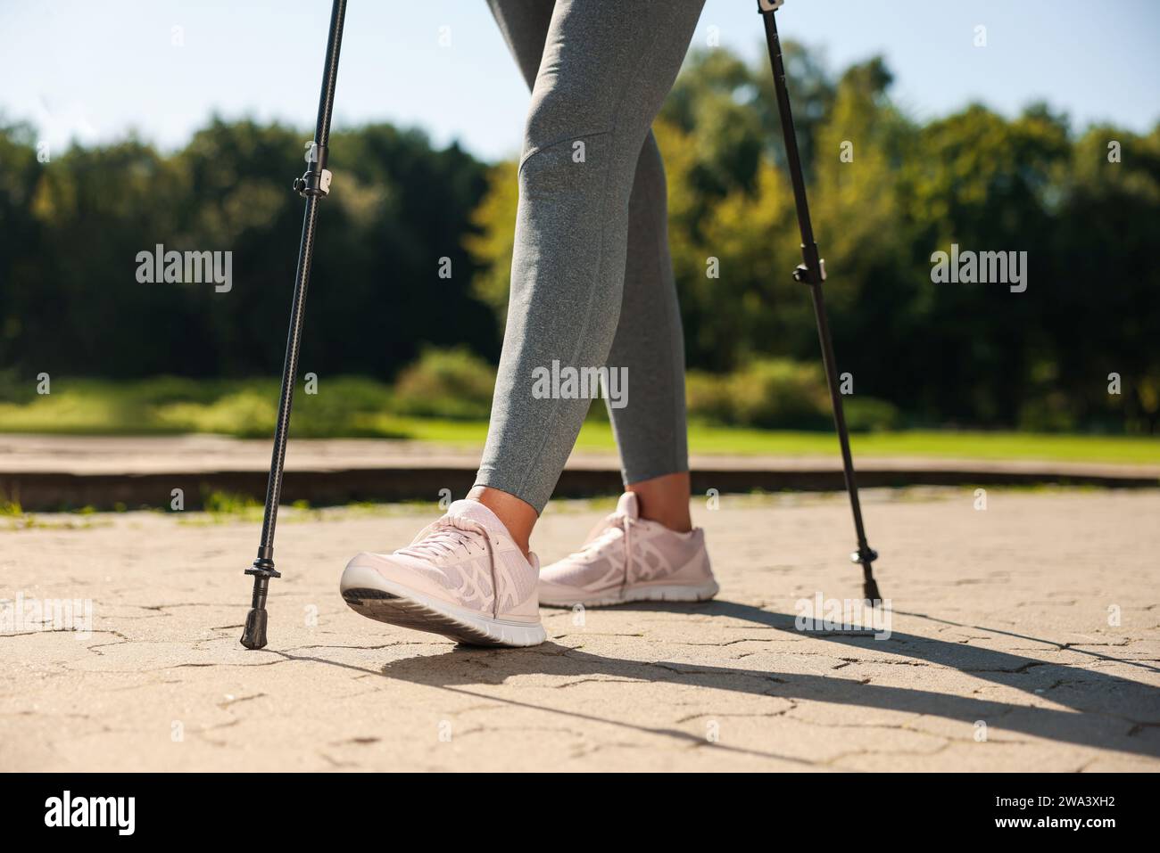 Athletic woman walking on pathway hi-res stock photography and images ...