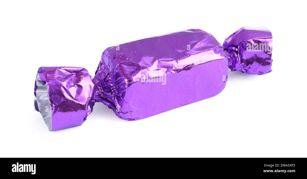 Tasty candy in purple wrapper isolated on white Stock Photo - Alamy