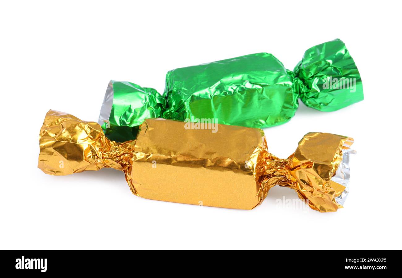 Two candies in colorful wrappers isolated on white Stock Photo - Alamy