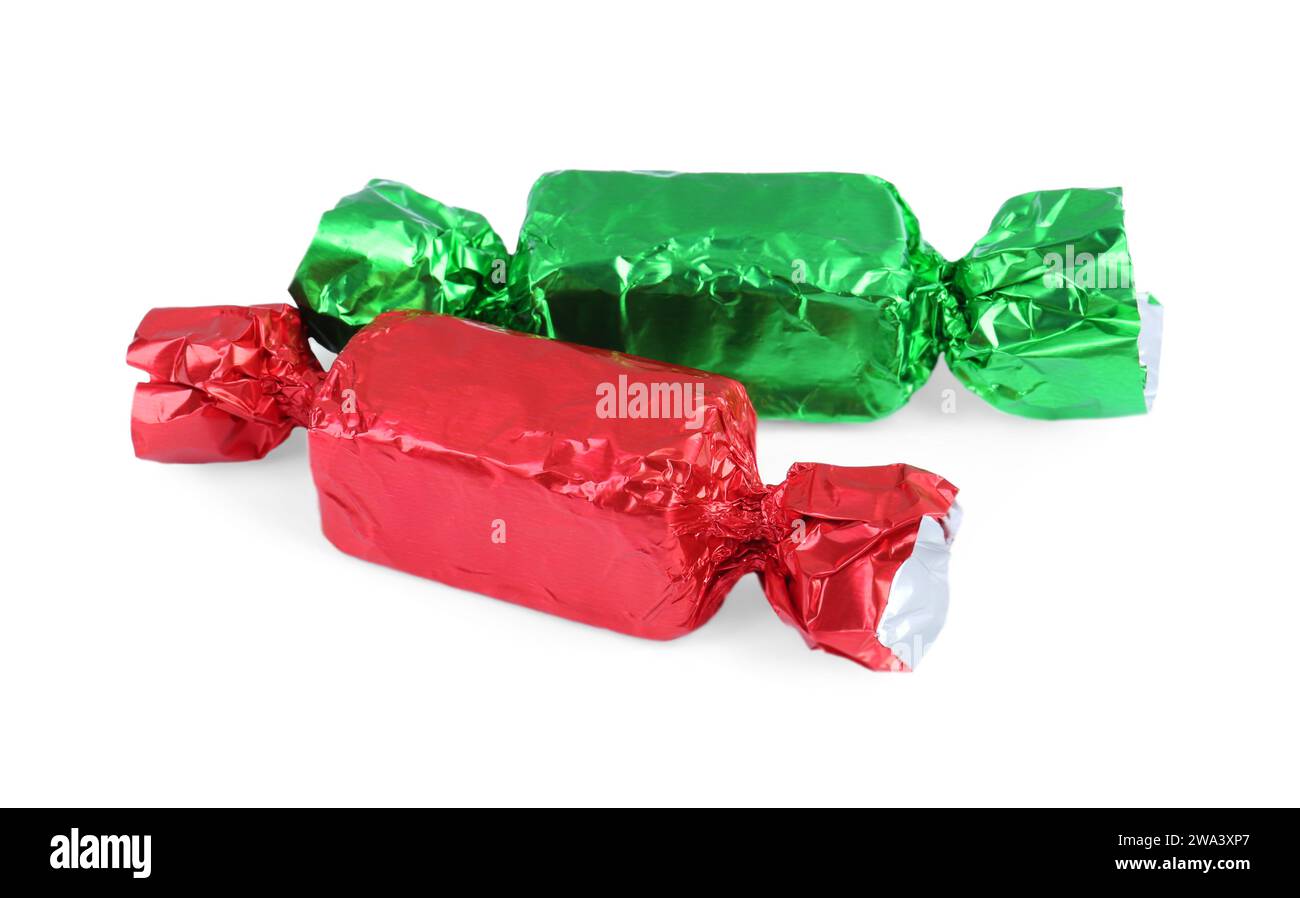 Two candies in colorful wrappers isolated on white Stock Photo - Alamy