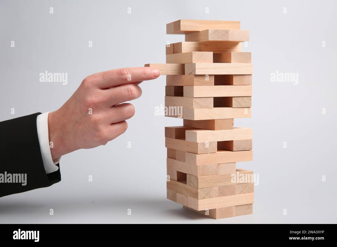 Woman playing Jenga on light gray background, closeup Stock Photo - Alamy