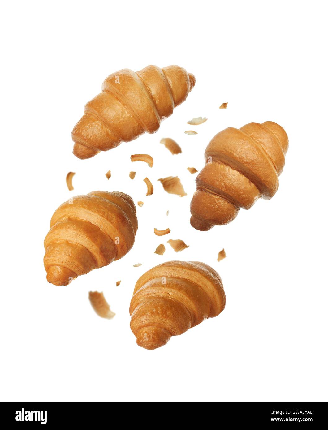 Delicious fresh croissants falling on white background Stock Photo - Alamy
