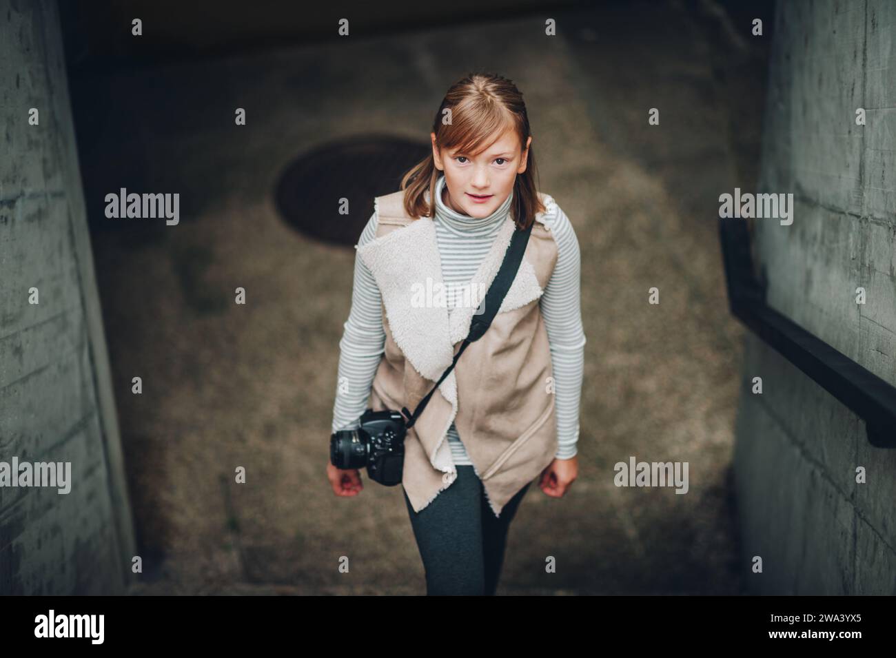 Outdoor portrait of cute preteen girl, fashion for children, top view ...