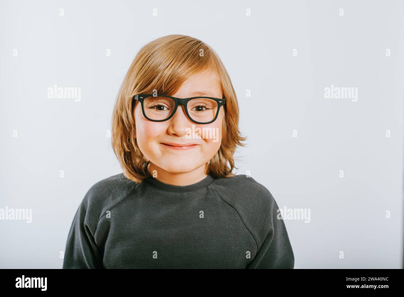Studio shot of cute little boy wearing eyeglasses Stock Photo - Alamy