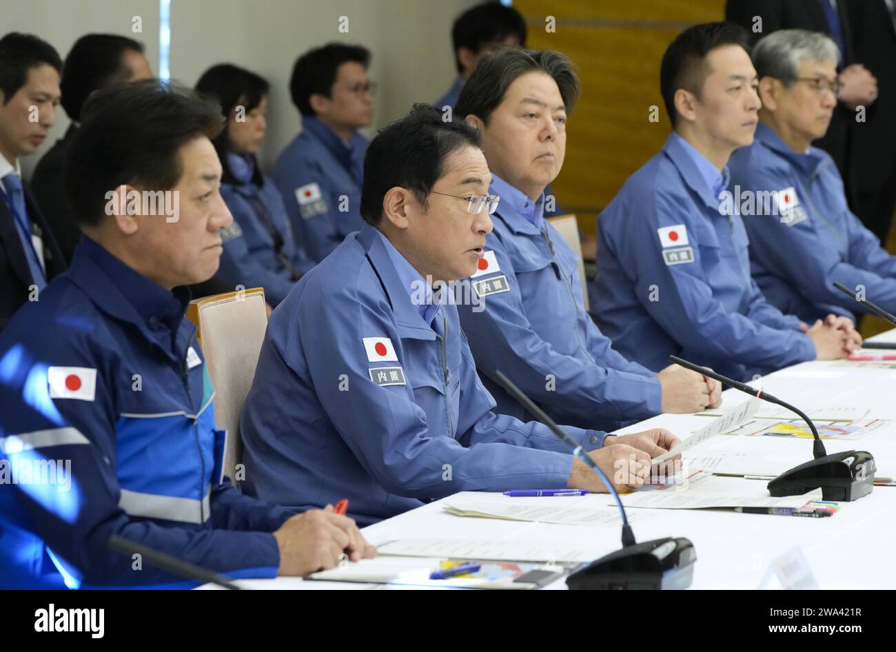 Japanese Prime Minister Fumio Kishida (2nd from L) speaks during a ...
