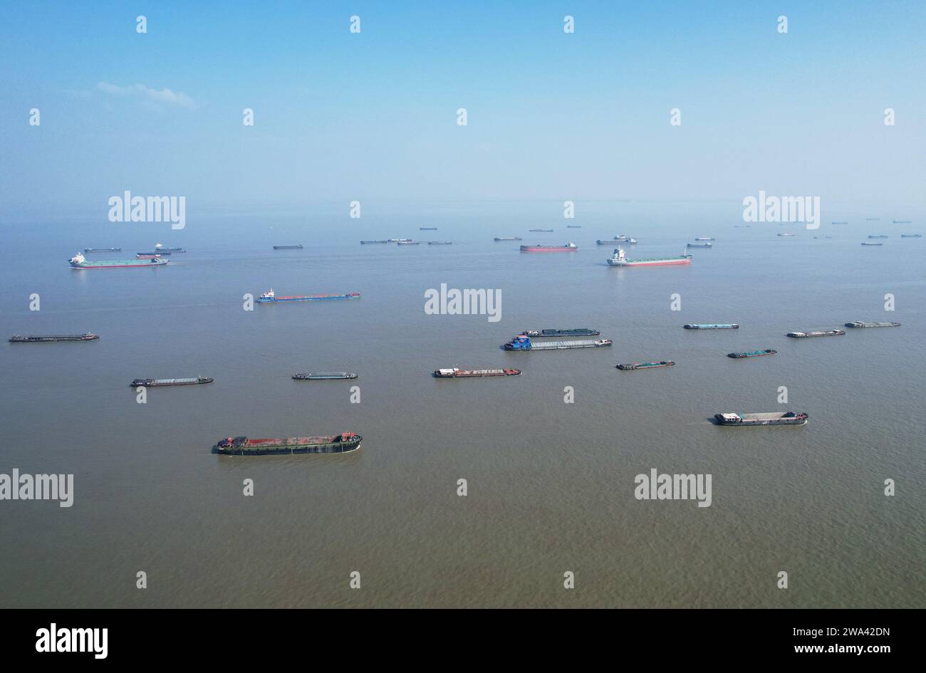 SHANGHAI, CHINA - JANUARY 1, 2024 - Cargo ships sailing along the ...
