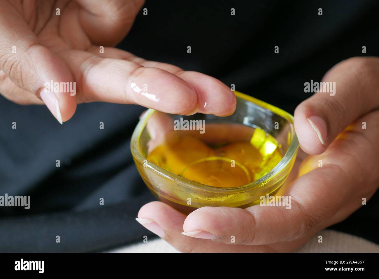 Women hand using olive oil hi-res stock photography and images - Alamy