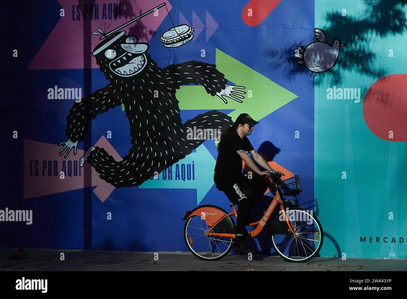 Santiago, Metropolitana, Chile. 1st Jan, 2024. A man rides his bicycle ... Santiago, Metropolitana, Chile. 1st Jan, 2024. A man rides his bicycle ...