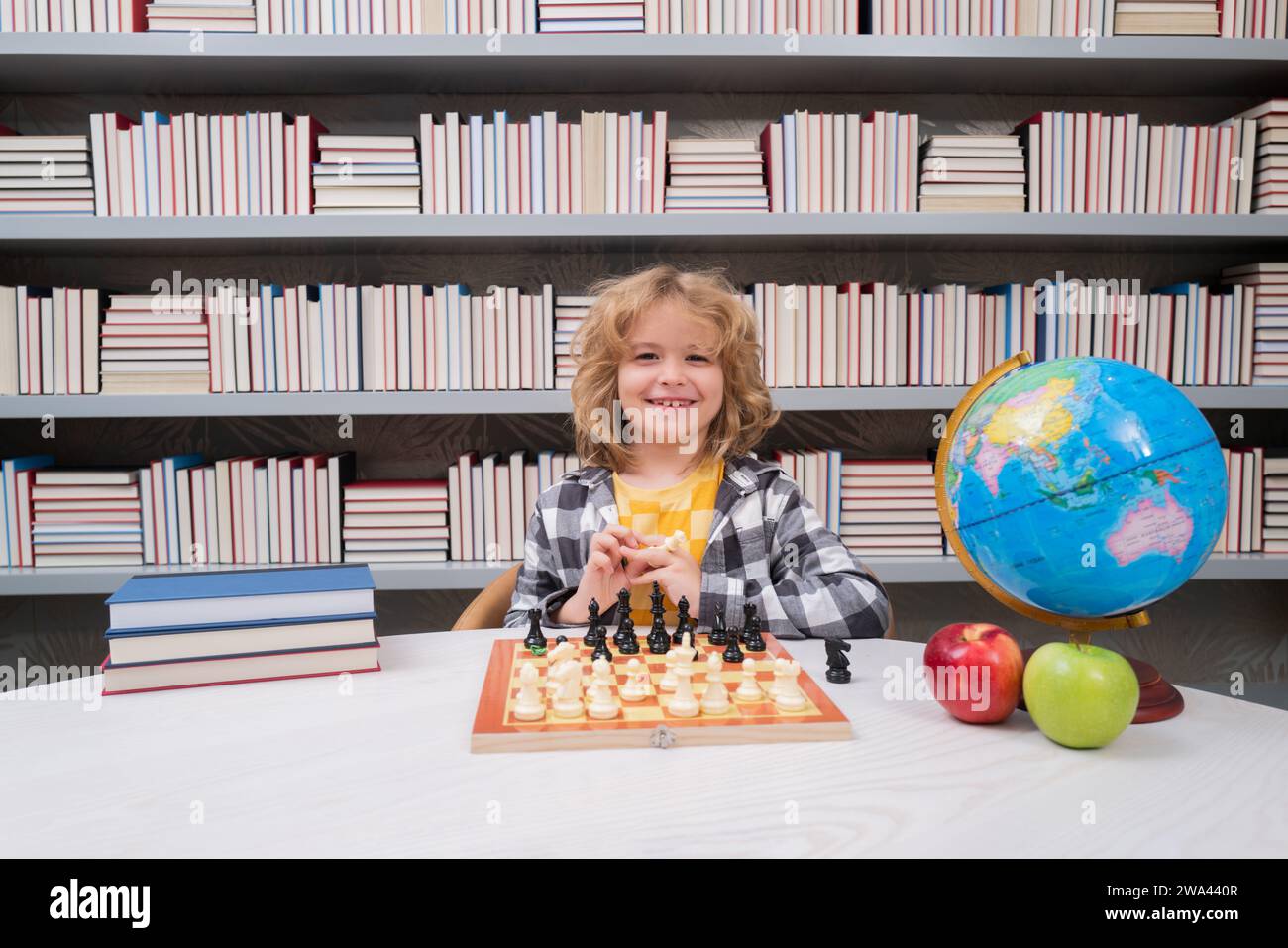 Play chess. Clever child thinking about chess. Portrait of clever kid ...