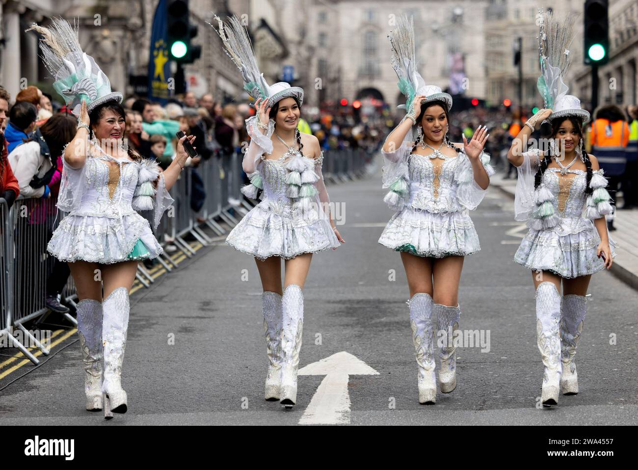 London, UK. 01st Jan, 2024. Performers seen waving at the crowds during the London New Year's ...