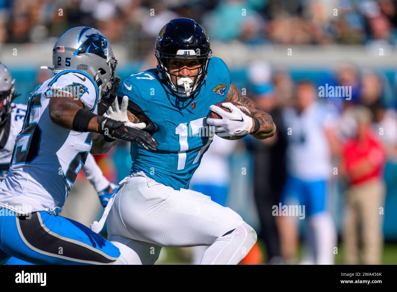 Jacksonville Jaguars tight end Evan Engram (17) runs with the ball past Carolina Panthers safety ...
