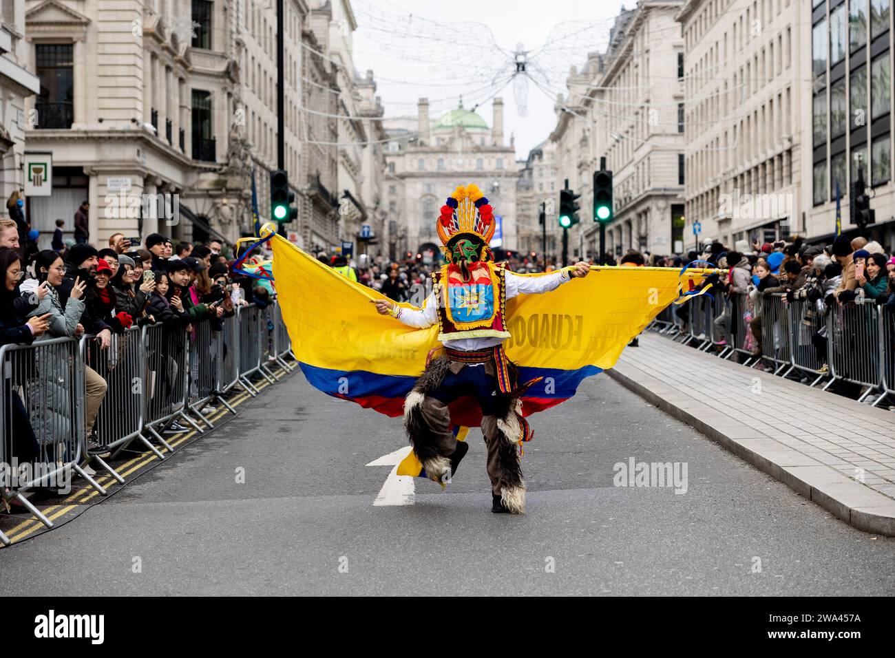 London, UK. 01st Jan, 2024. A performer seen in traditional indigenous costume during the London ...