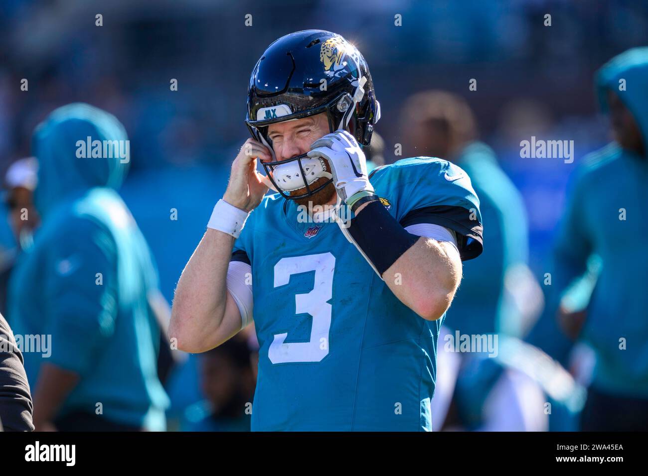 Jacksonville Jaguars quarterback C.J. Beathard (3) puts on his helmet ...