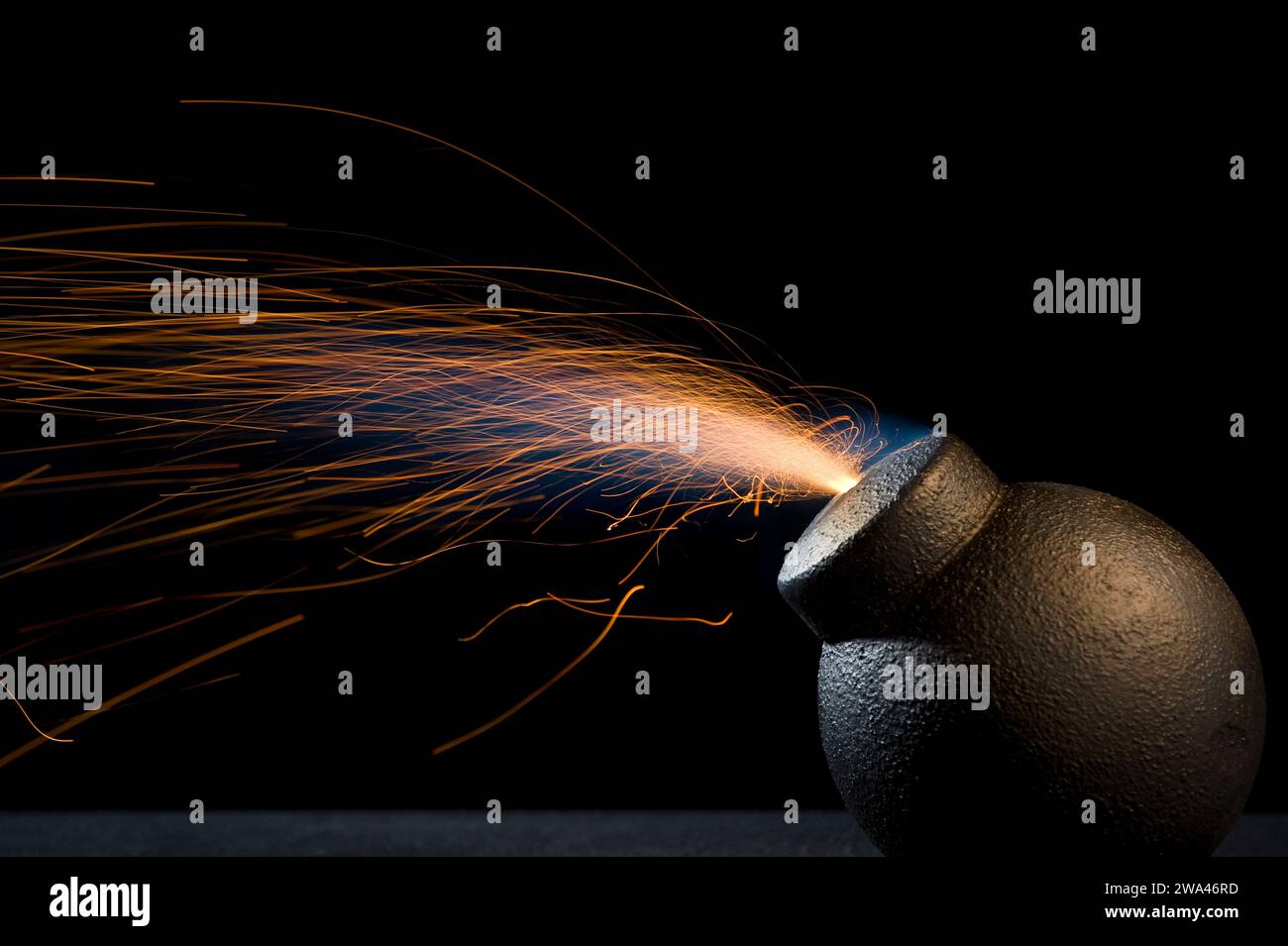 An old vintage round cast iron fragmentation bomb at the end of its ...