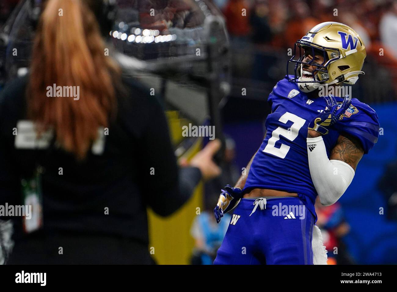 Washington wide receiver Ja'Lynn Polk (2) celebrates his touchdown ...