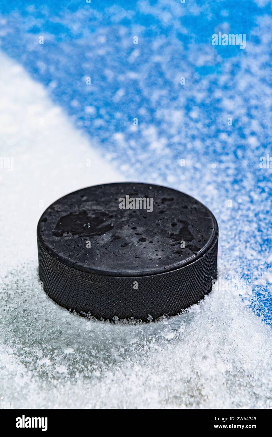 Looking down on an ice hockey puck at the blue line Stock Photo - Alamy