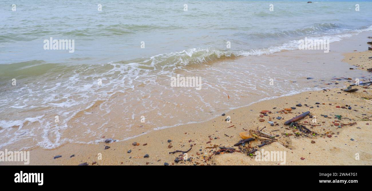Natural View Of A Tropical Beach With Small And Calm Sea Waves, At ...
