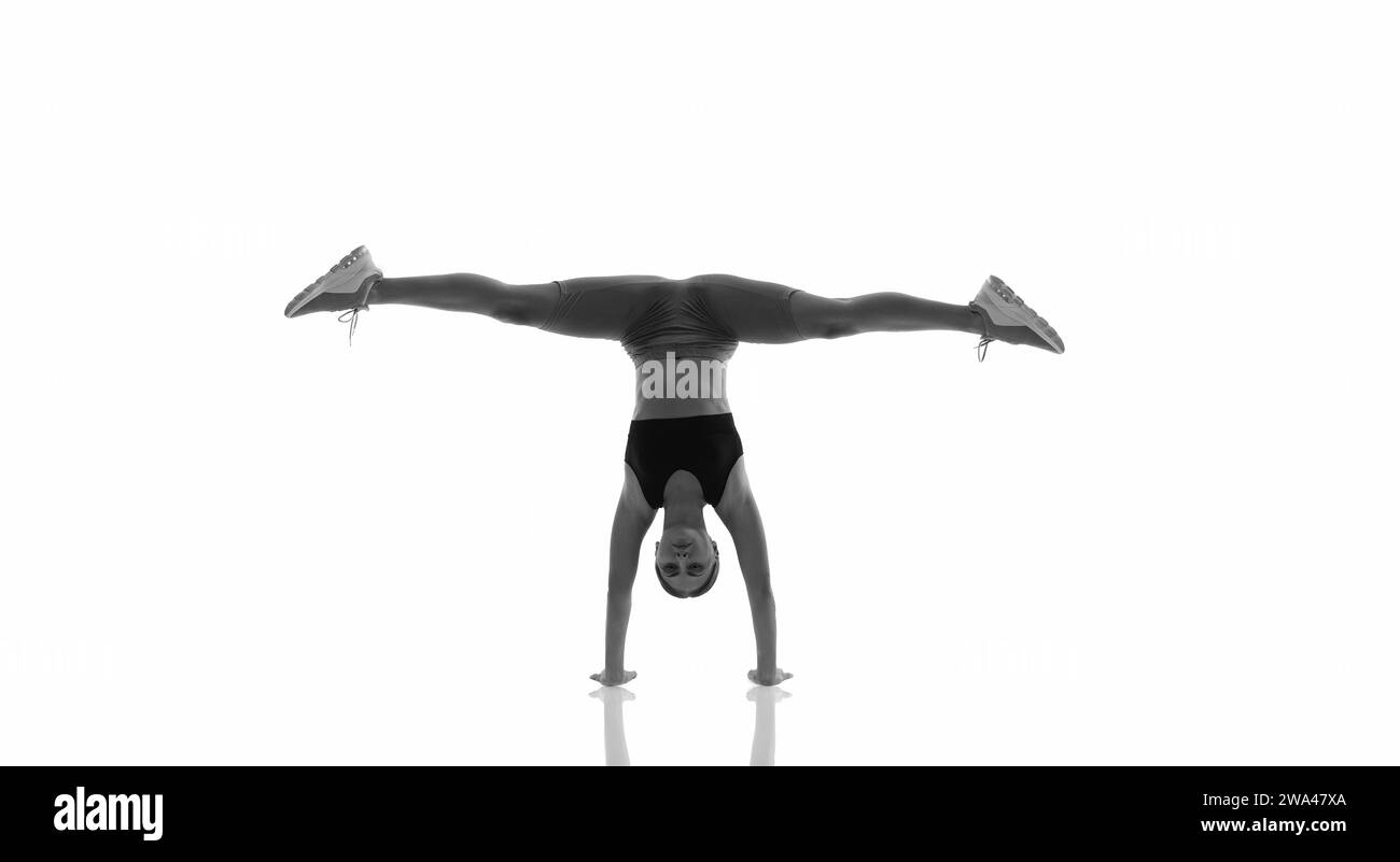 sport woman do split isolated on white. sport woman do split in studio ...