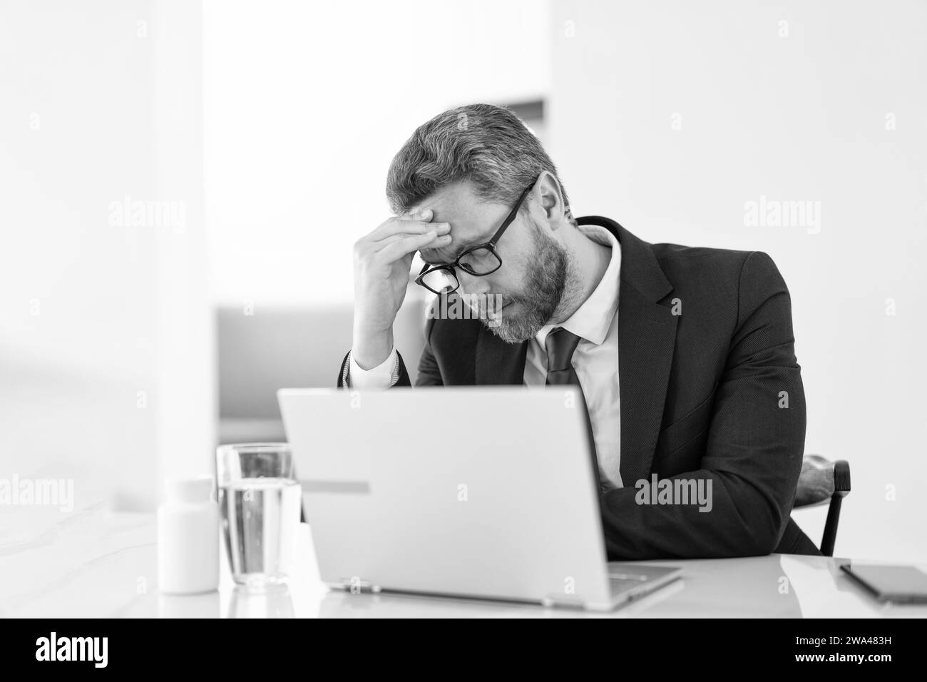 overworked man manager has pain and fatigue. photo of man manager has ...
