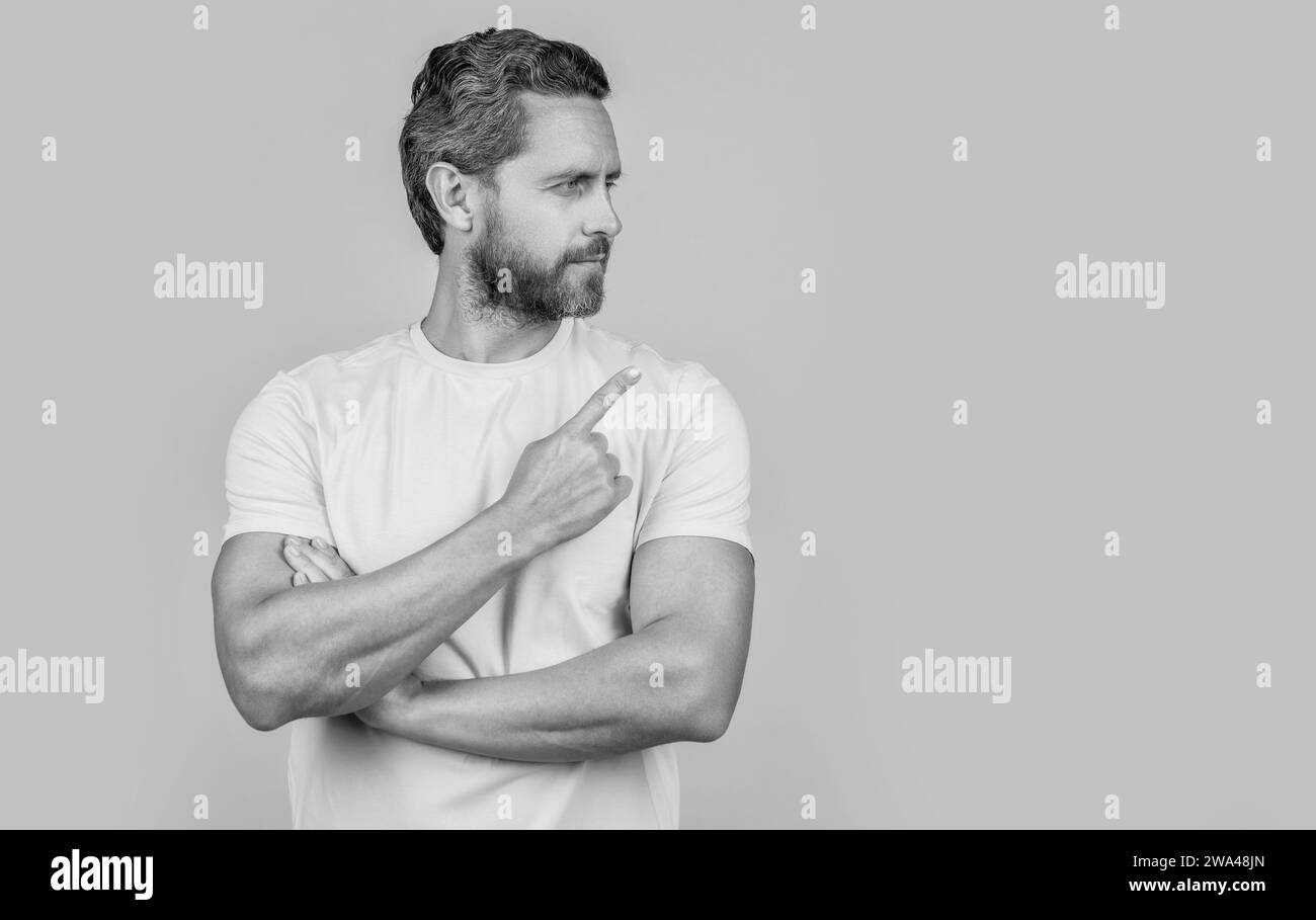 man pointing at advertisement offer isolated on yellow banner. man ...