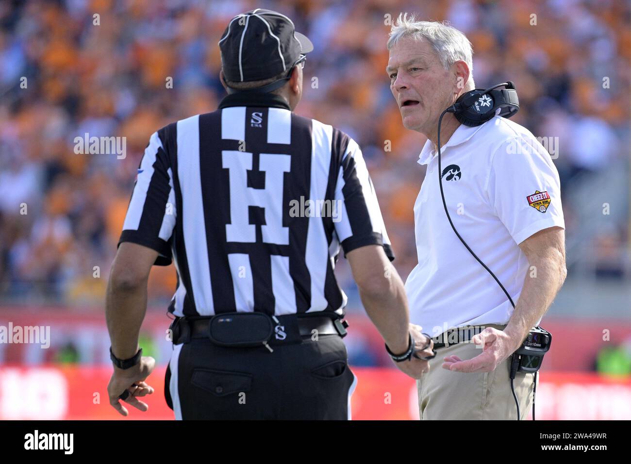 Iowa head coach Kirk Ferentz, right, talks with an official on the ...