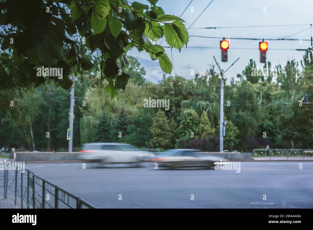 Traffic on highway, blurred motion. Traffic light in crossroad near ...