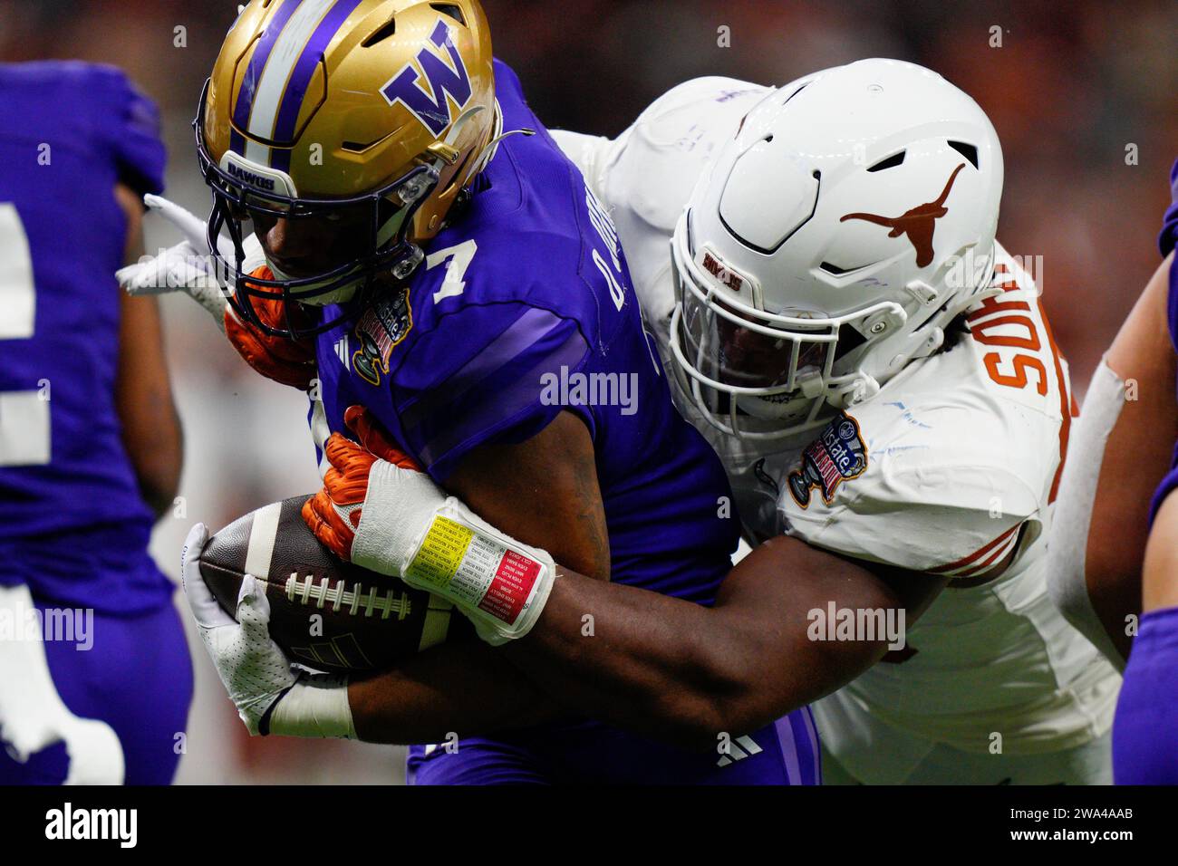 Texas defensive end Barryn Sorrell (88) tackles Washington running back ...