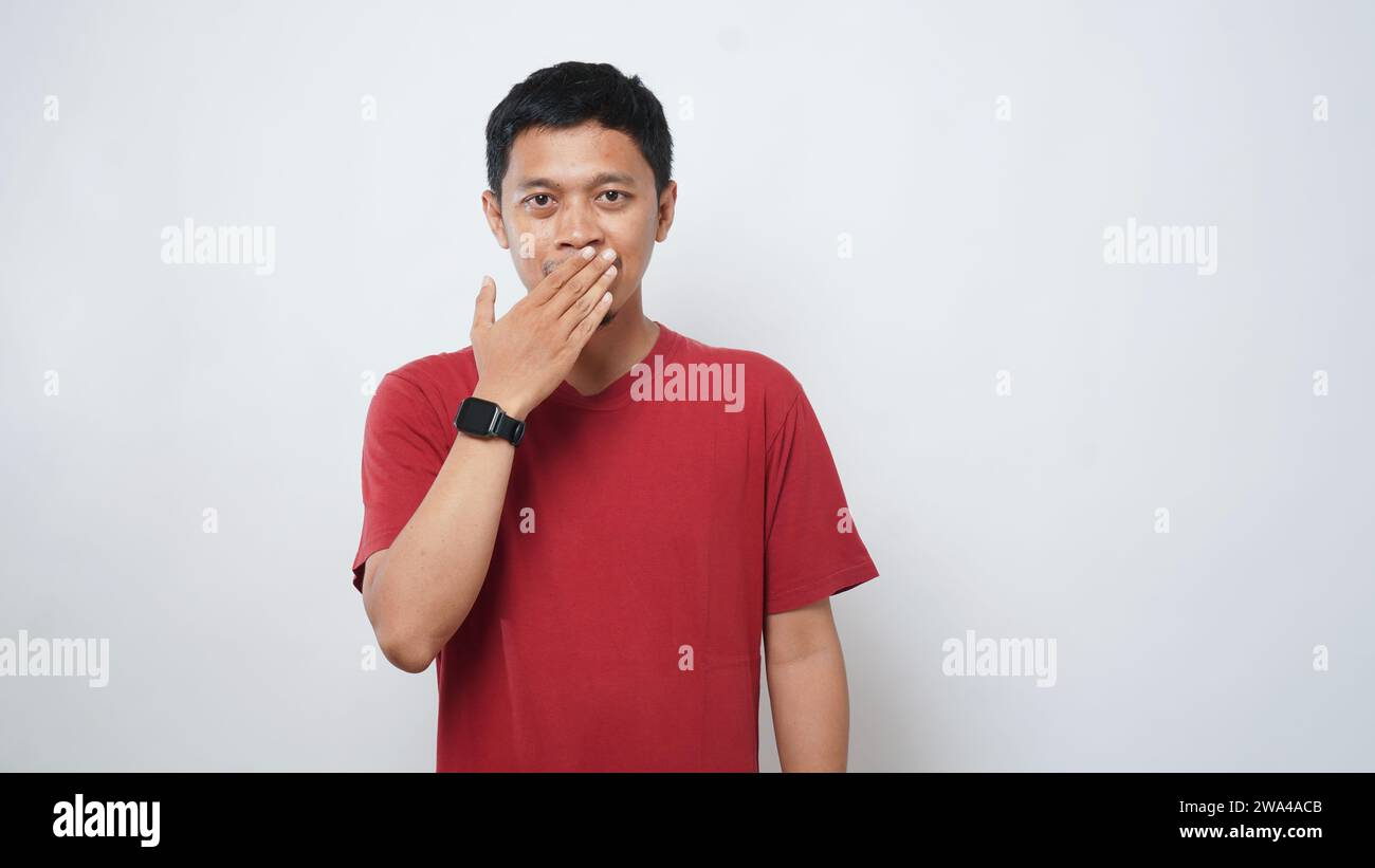 Asian man is using sign language with hand against white background ...