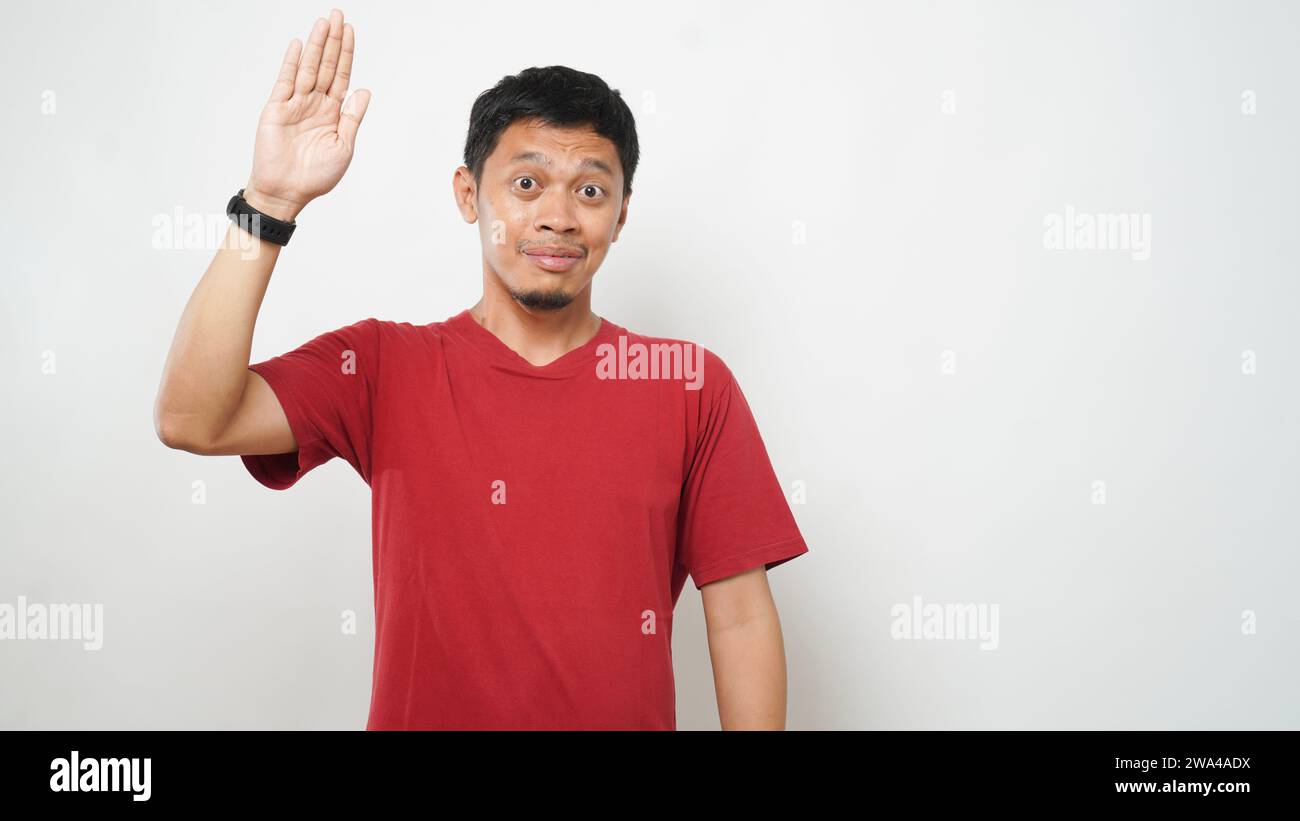 Asian man is using sign language with hand against white background ...