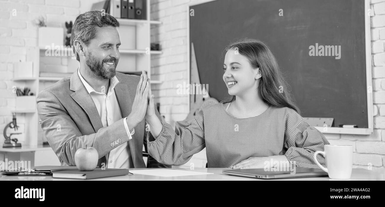 happy kid study in classroom with tutor Stock Photo - Alamy