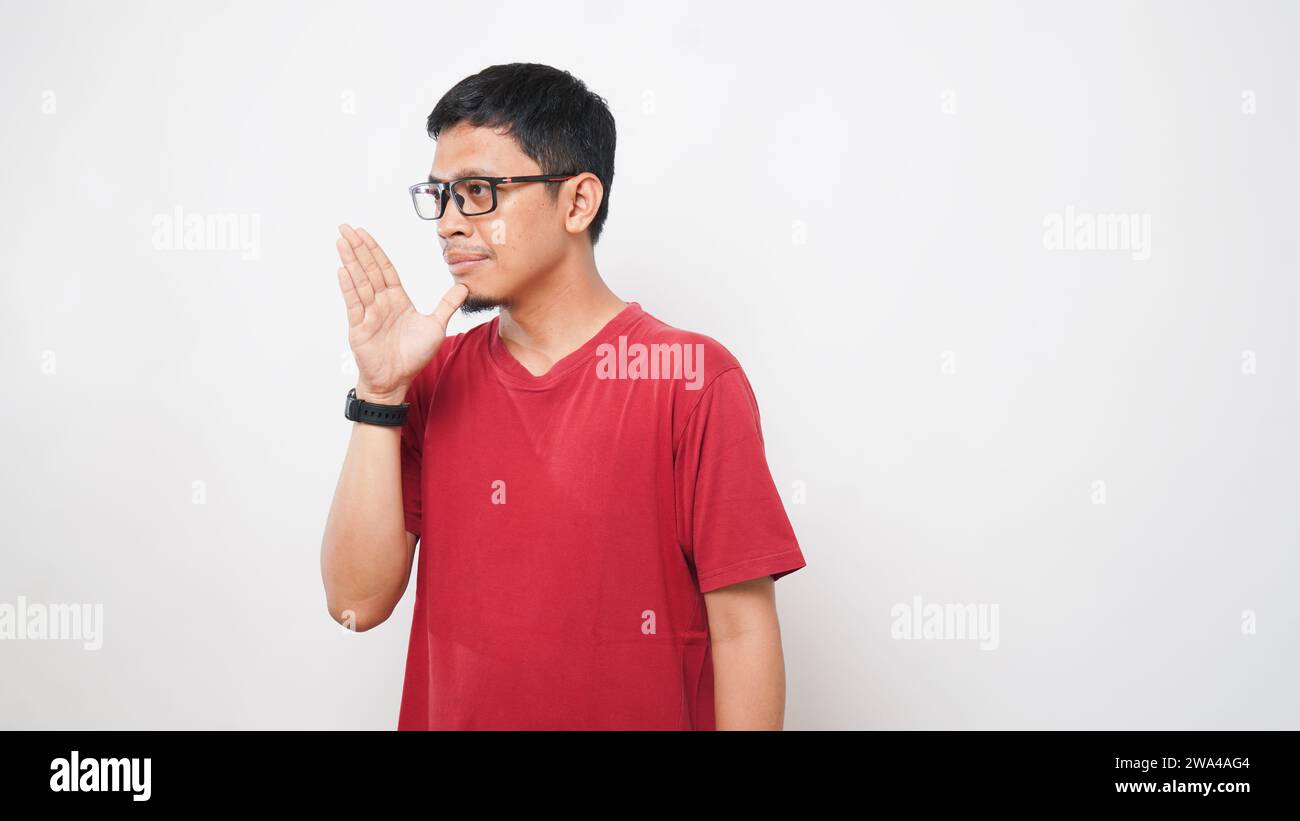 Asian man is using sign language with hand against white background ...