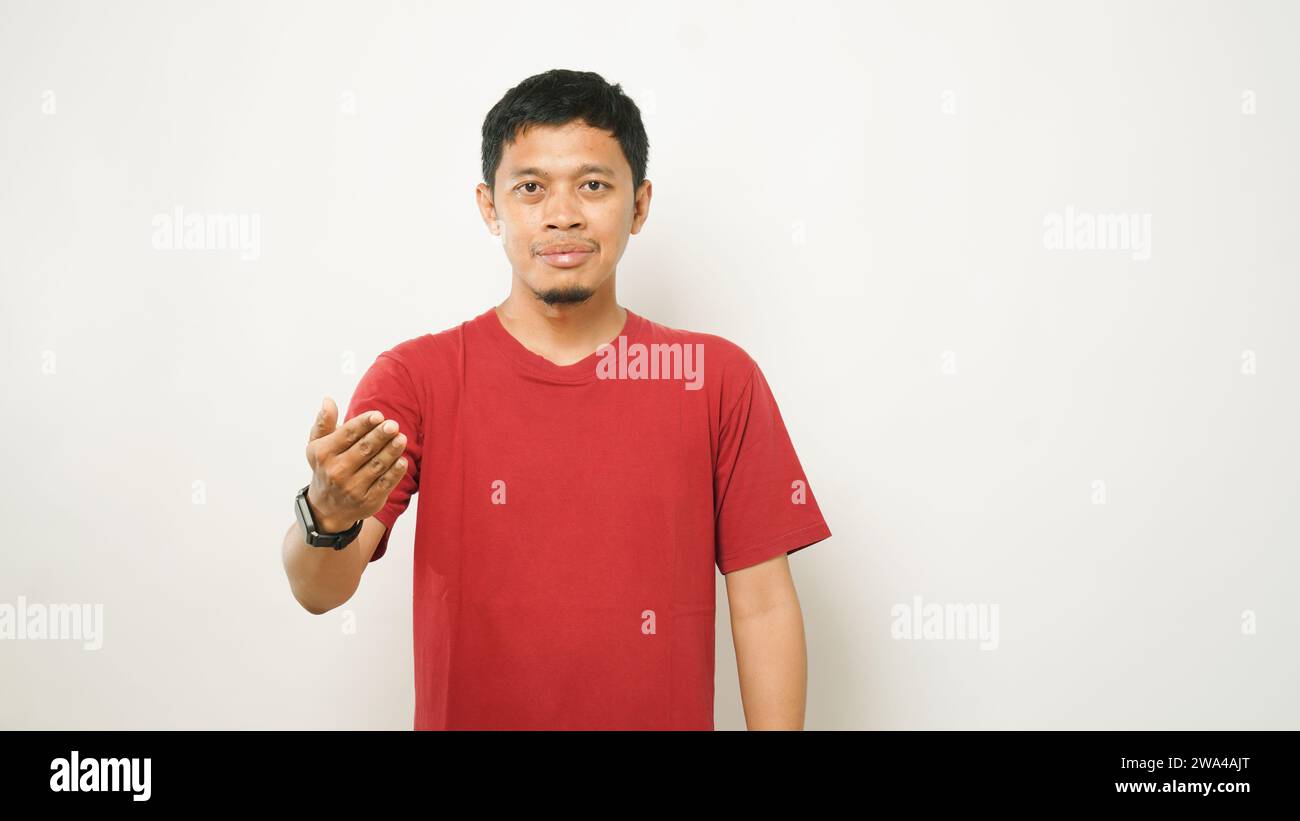 Asian man is using sign language with hand against white background ...