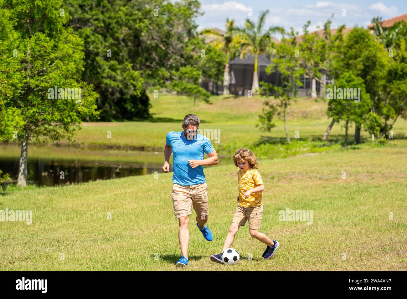 adventures between father and son. Active father son playing football ...