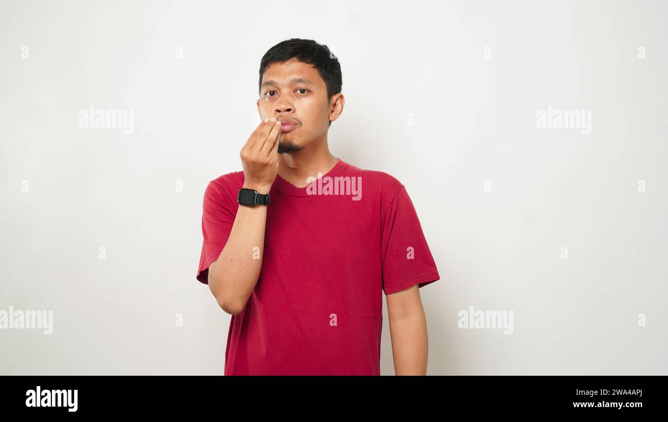 Asian man is using sign language with hand against white background ...