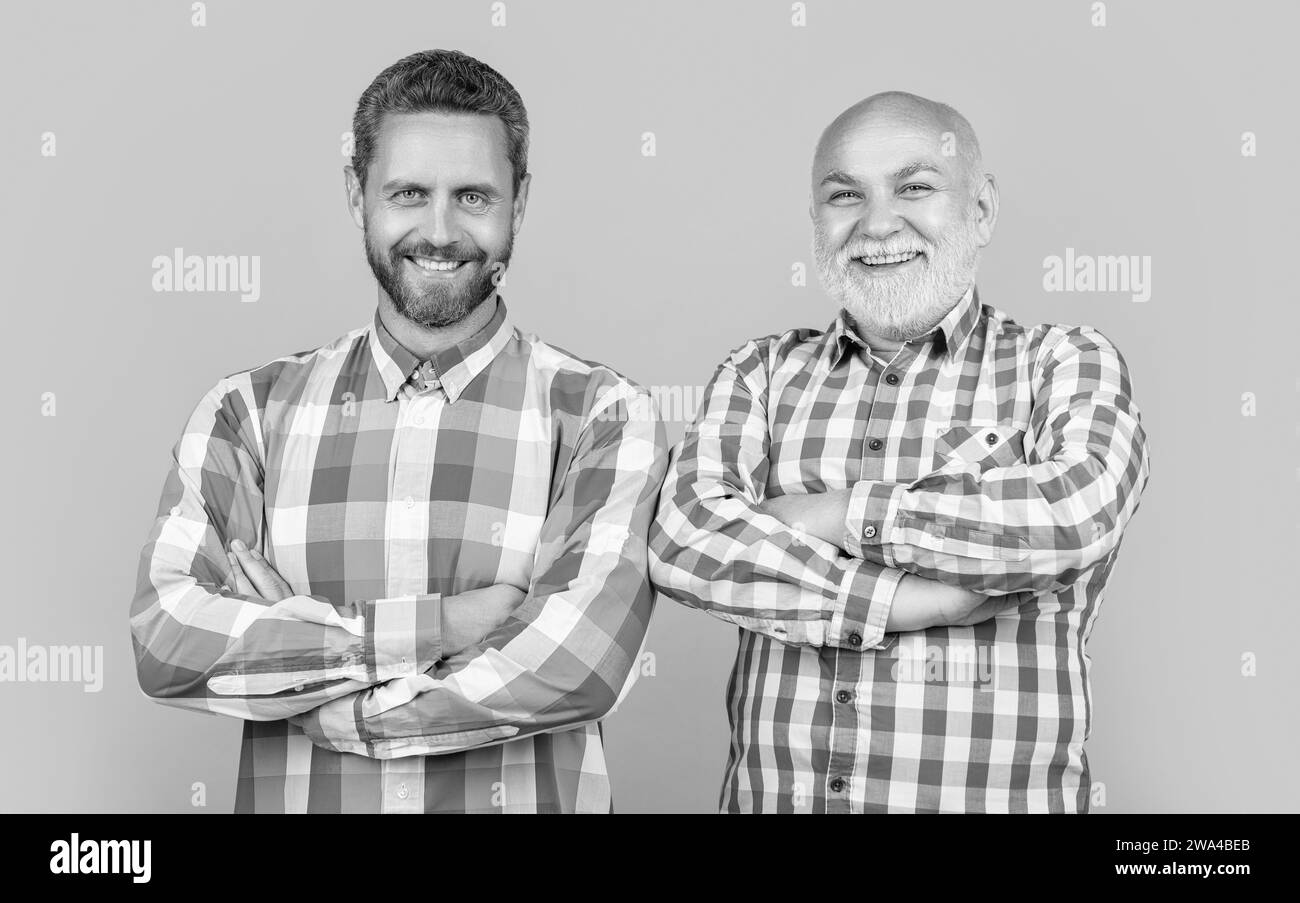 happy two generation family men in studio. two generation family men on ...