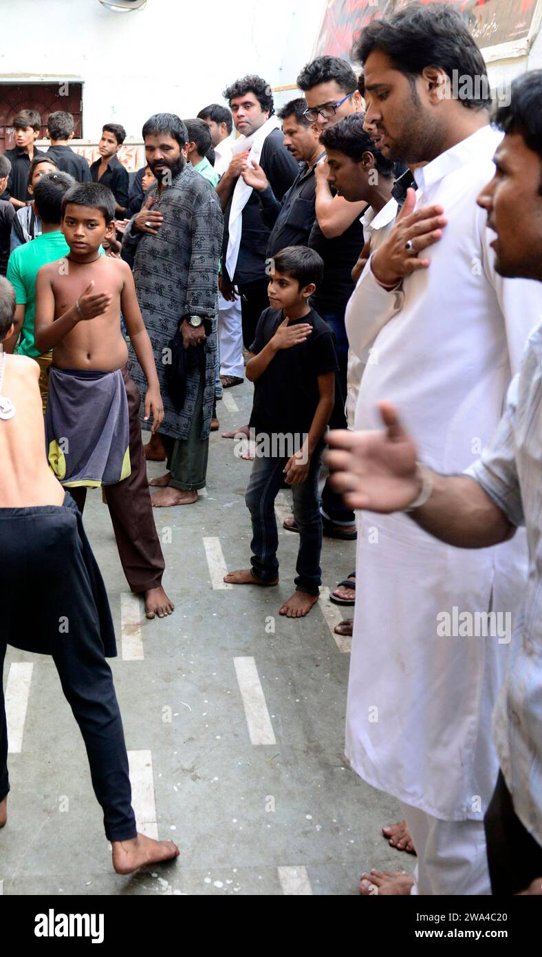 Shia men flogging themselves during the Muharram mourning festival of ...