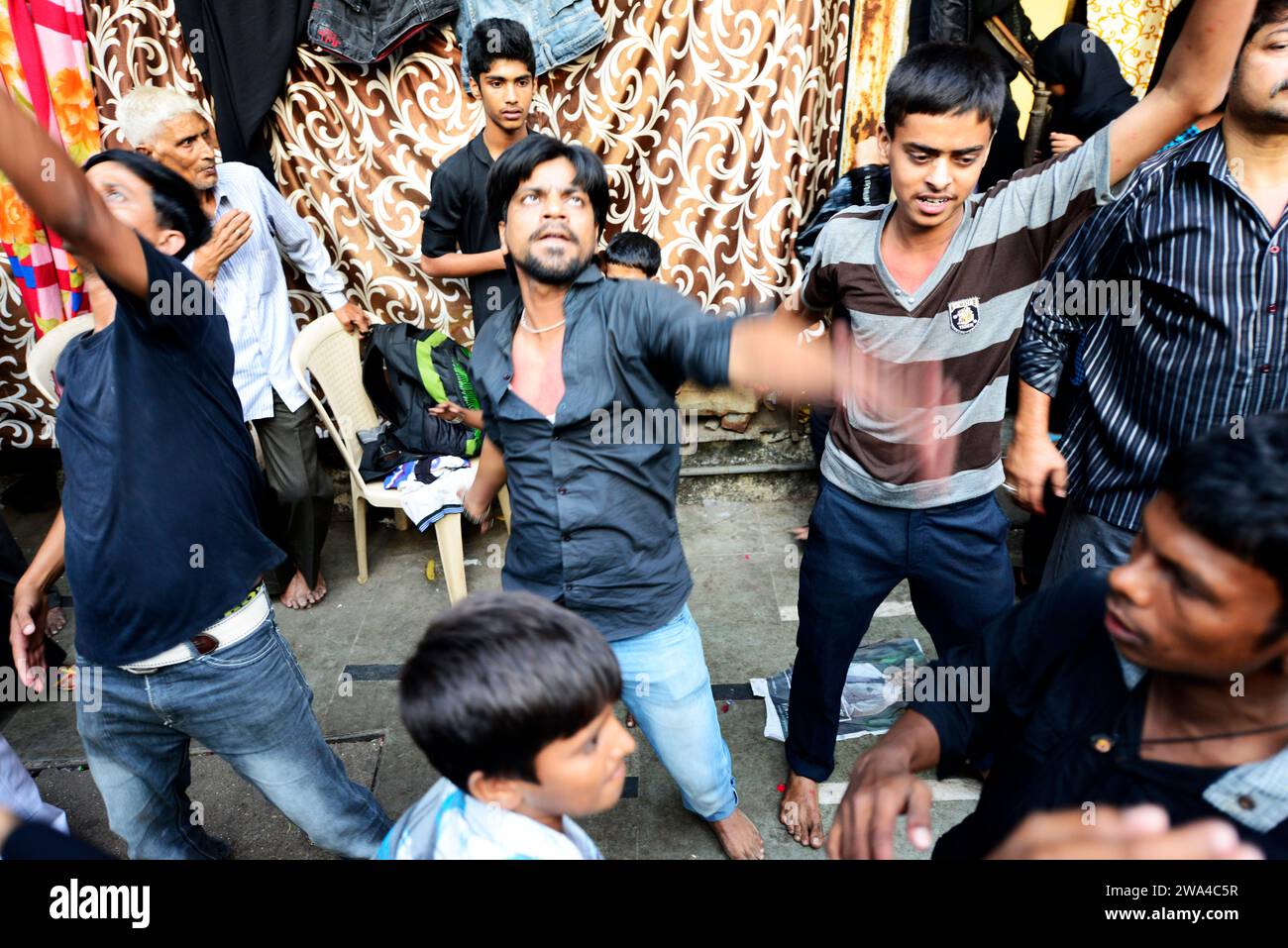 Shia men flogging themselves during the Muharram mourning festival of ...