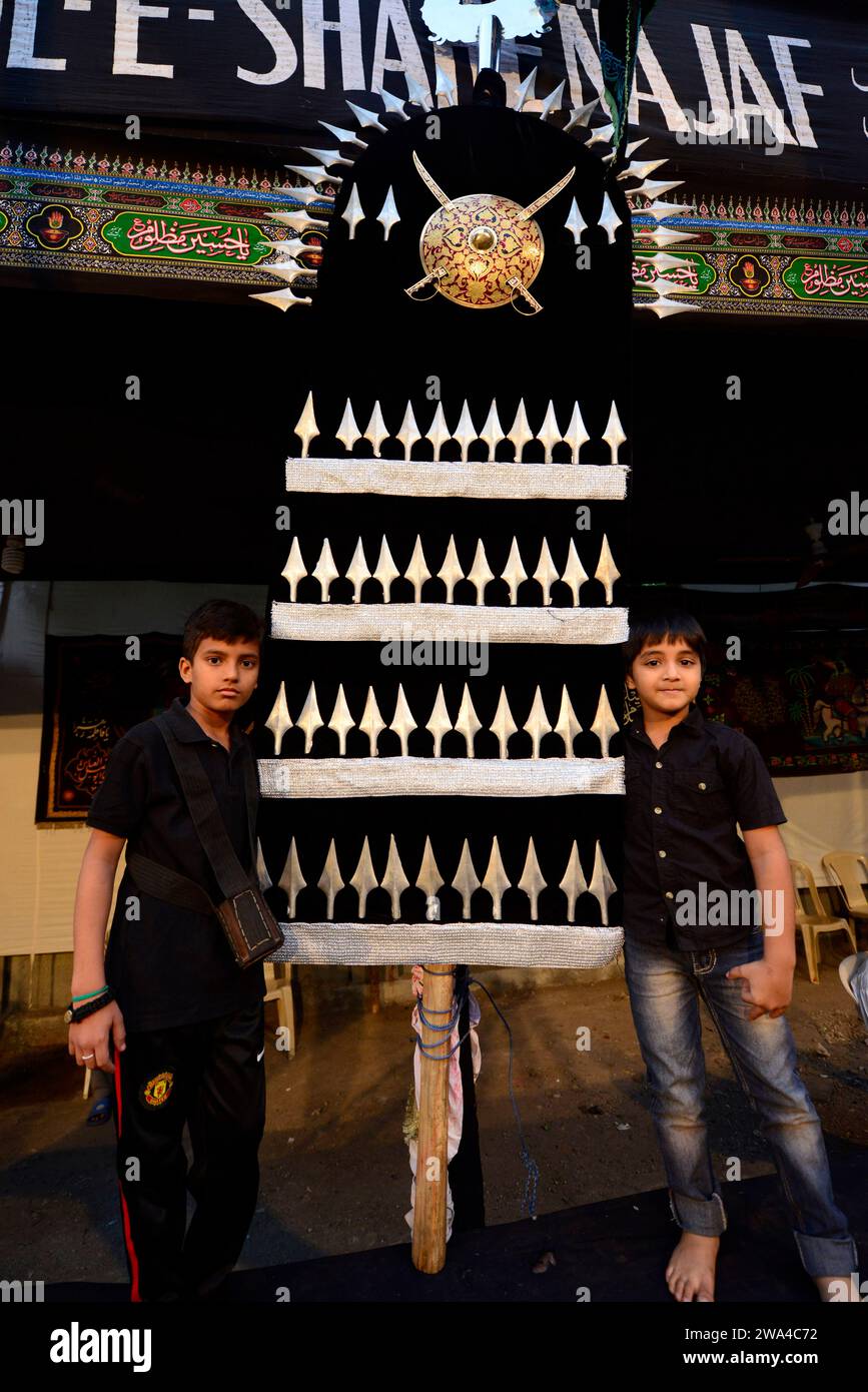 Indian Shia boys posing for a picture during the Muharram holy month ...